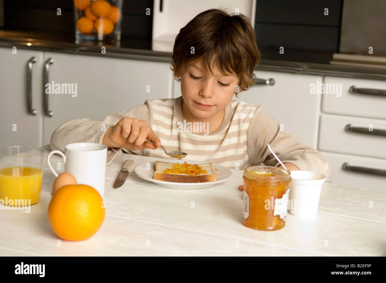 Boy having breakfast Stock Photo - Alamy
