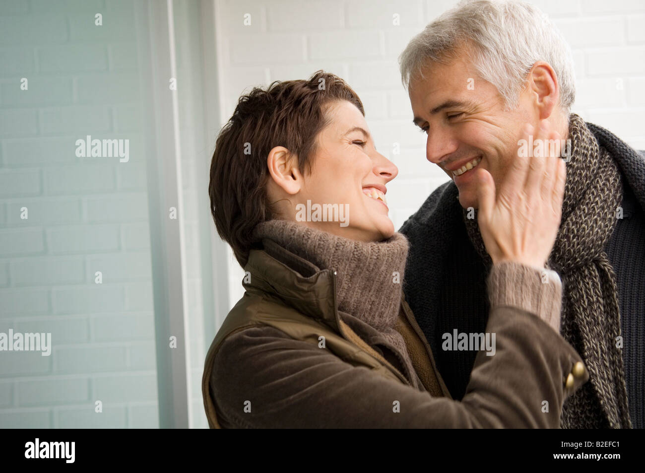 Close-up of a mid adult woman and a mature man romancing Stock Photo ...