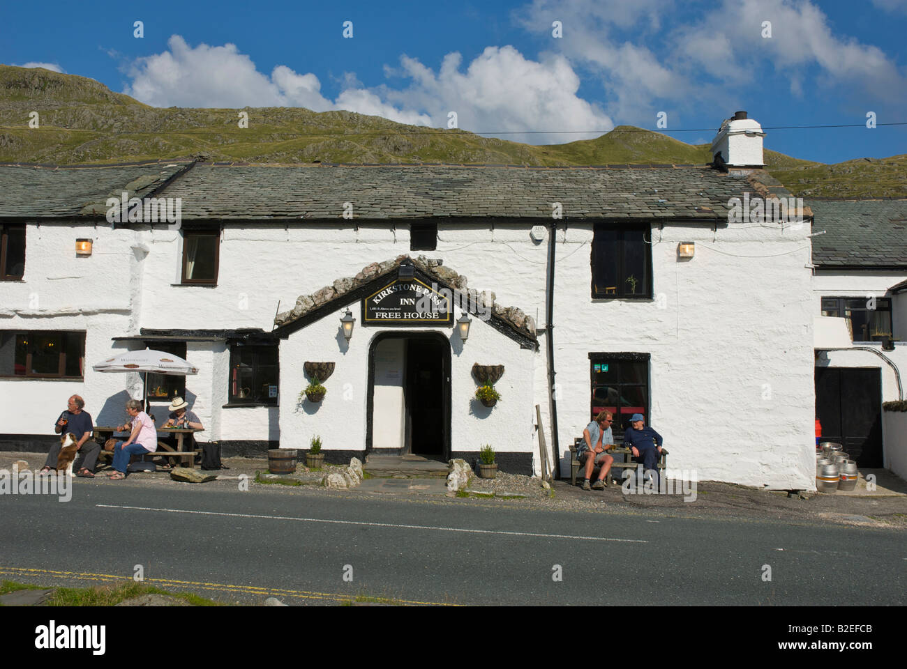 Five people enjoying a drink outside the Kirkstone Pass Inn, the third ...