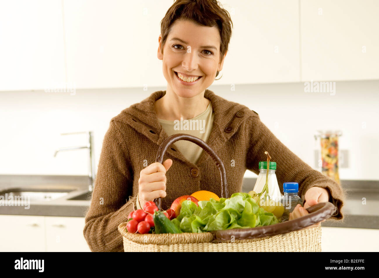 Woman holding a basket on her head hi-res stock photography and images ...