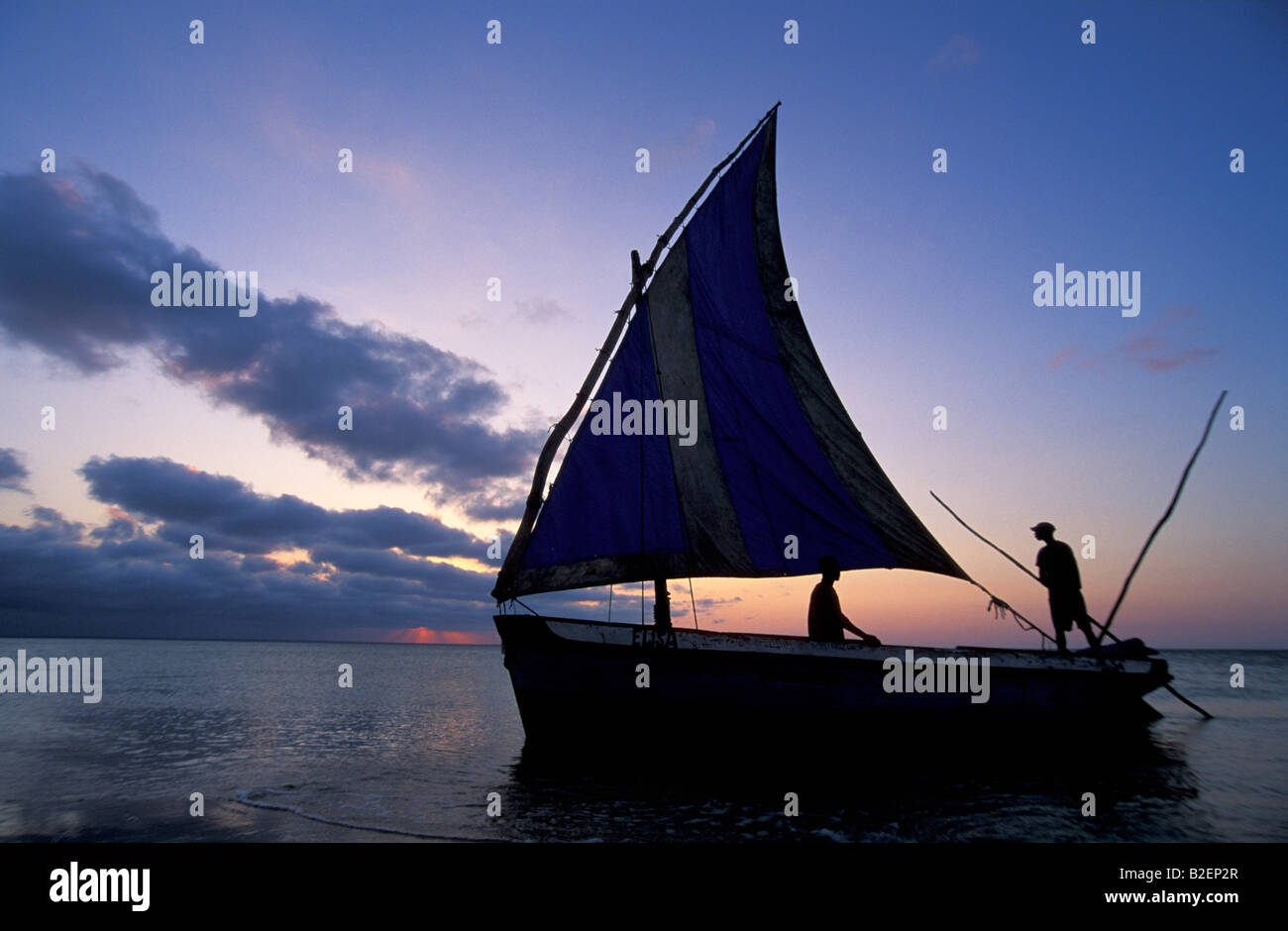 Traditional Dhow silhouetted at sunset Stock Photo - Alamy