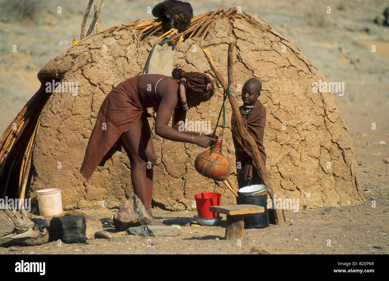 Himba woman and child at their homestead Stock Photo - Alamy