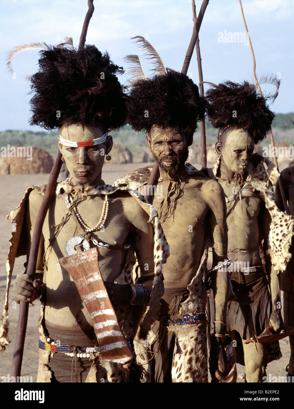 Men dance during a month-long Dassanech ceremony. They wear leopard ...