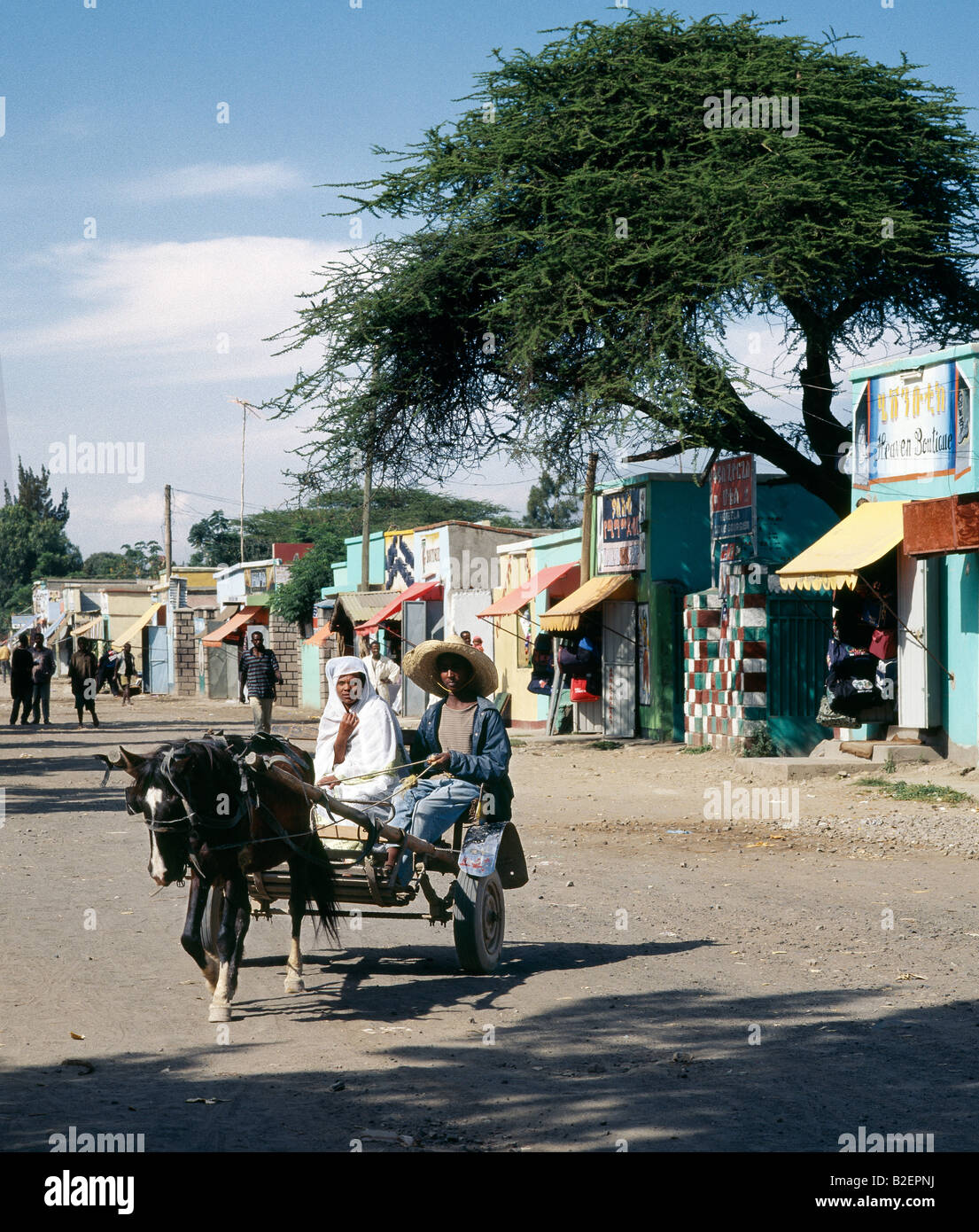 A colourful street scene at Ziway, Central Ethiopia.Horse-drawn buggies ...