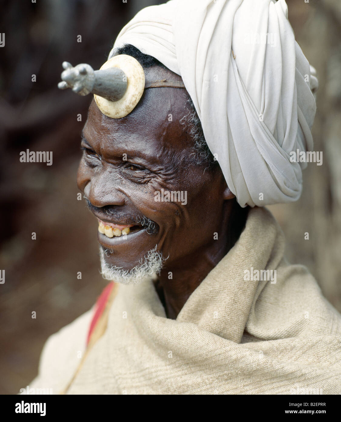 A Konso man wears a phallic Kallaacha on his forehead. Made of cast ...