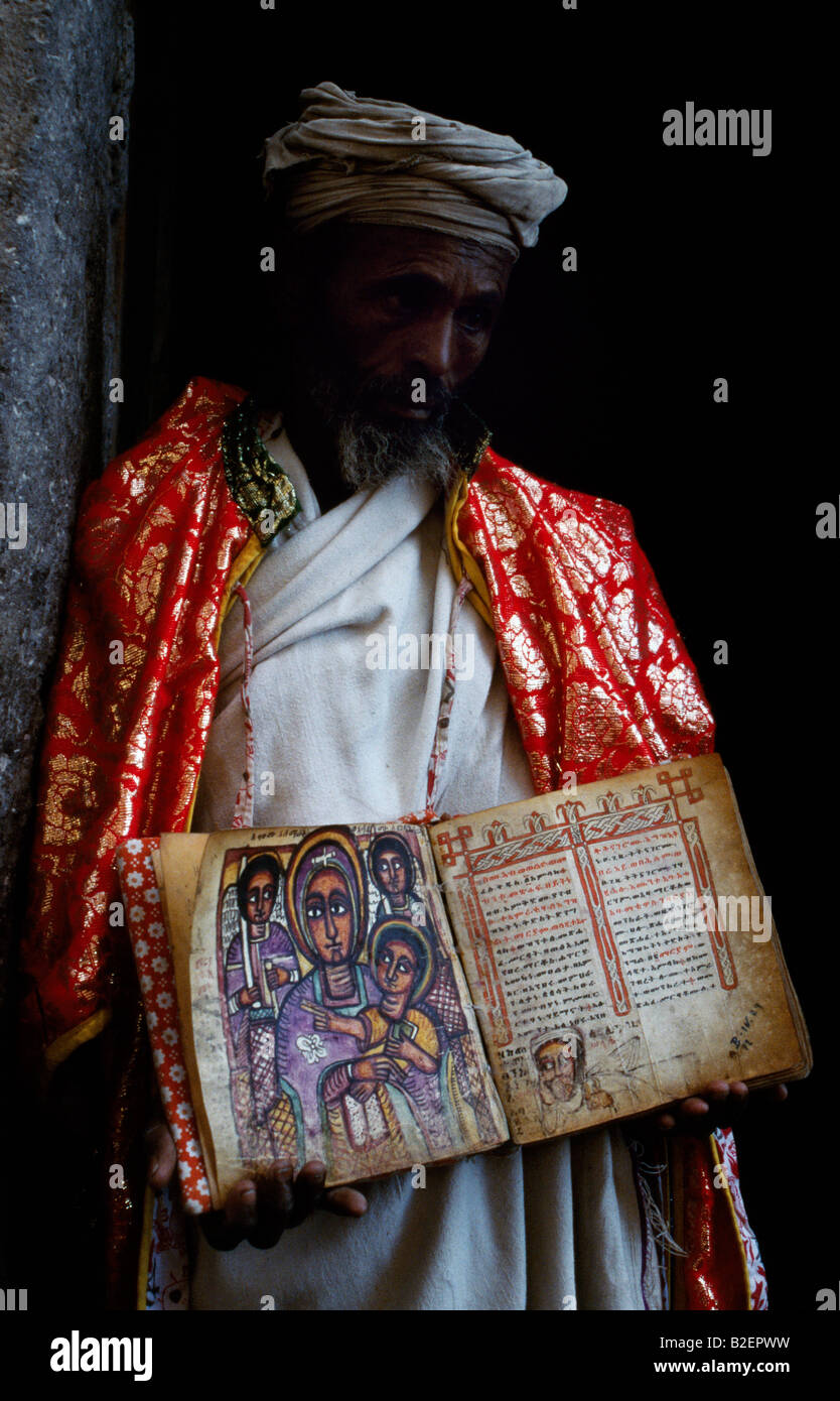 A priest holds one of the monastery's ancient illuminated texts Stock ...