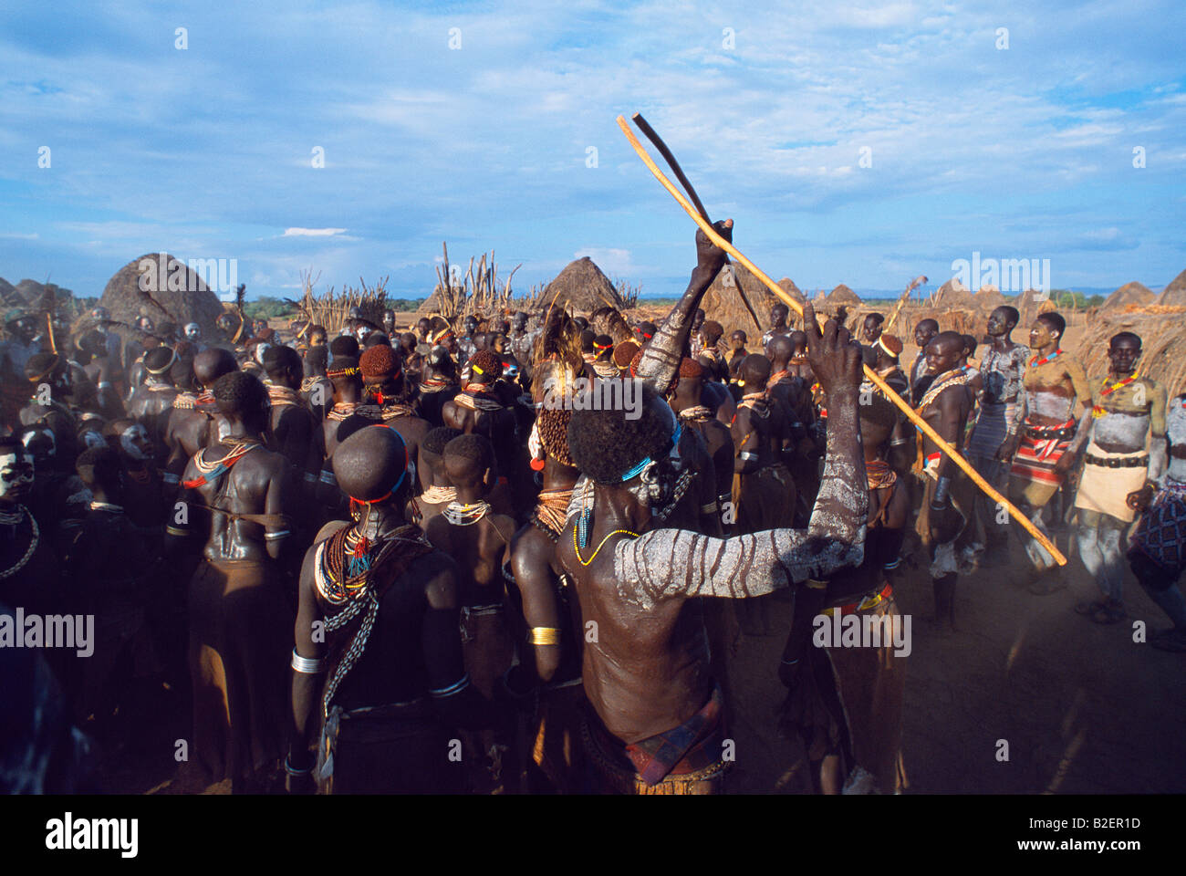 Men and women dance together in the Karo village of Duss. A small ...