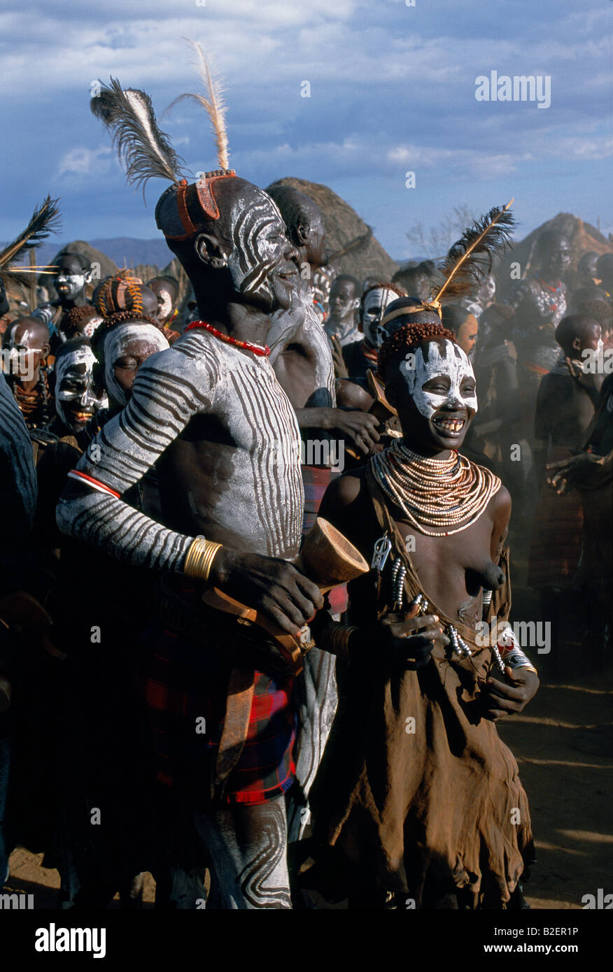 Men and women dance together in the Karo village of Duss. A small ...