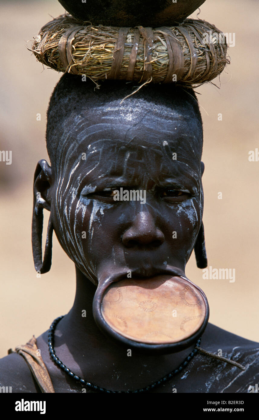A woman of the Mursi tribe. Once married Mursi women pierce their lower ...