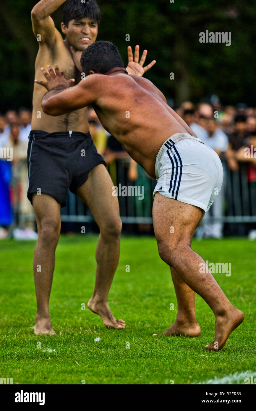 Two Kabbad players struggle together at a match between Birmingham and ...
