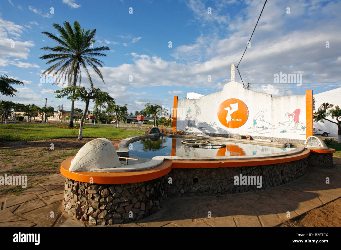 A monument in Inhambane town showing a map of Inhambane and people ...