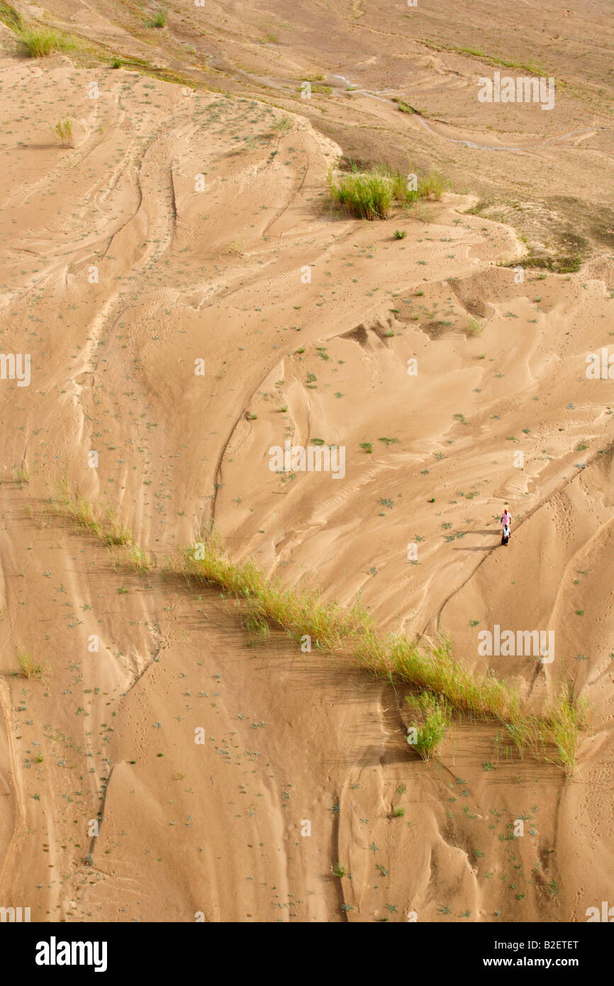 Aerial view of the Save River channel and two locals walking on a path ...