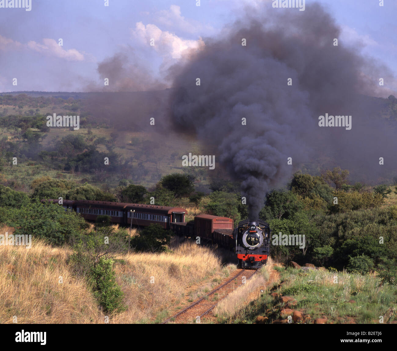 Steam train winding through the countryside in the Magaliesberg Stock ...