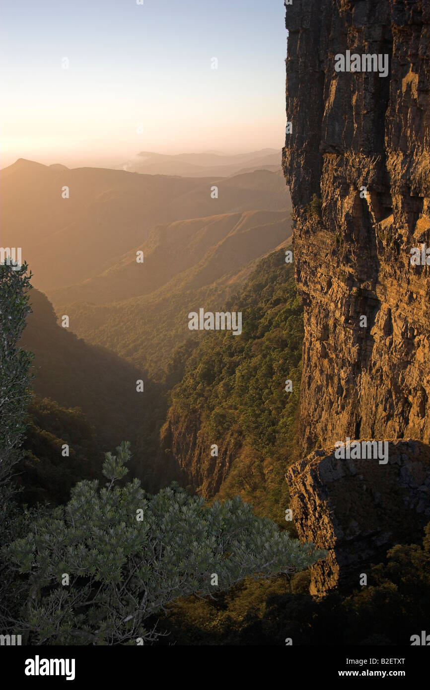 Mountain landscape with warm lighting shining on a cliff Stock Photo ...