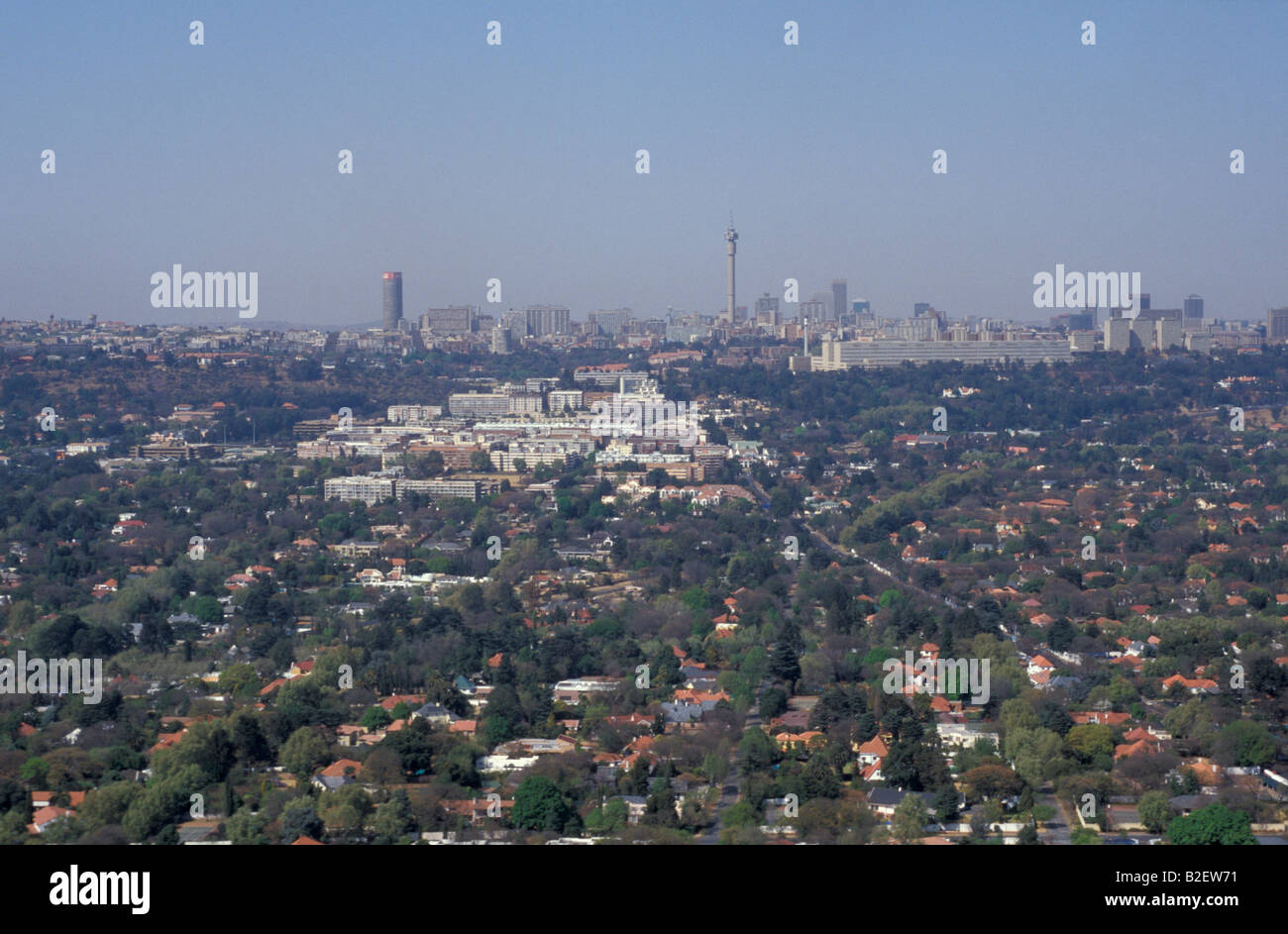Aerial view of the Johannesburg skyline showing well-vegetated suburbs ...
