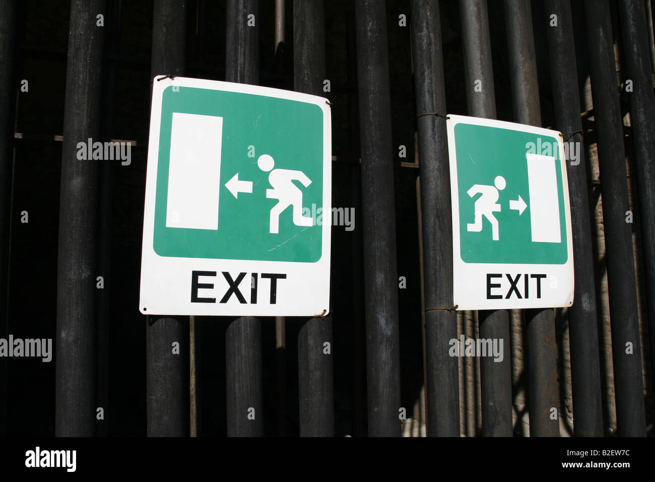 two emergency exit signs outdoors Stock Photo - Alamy