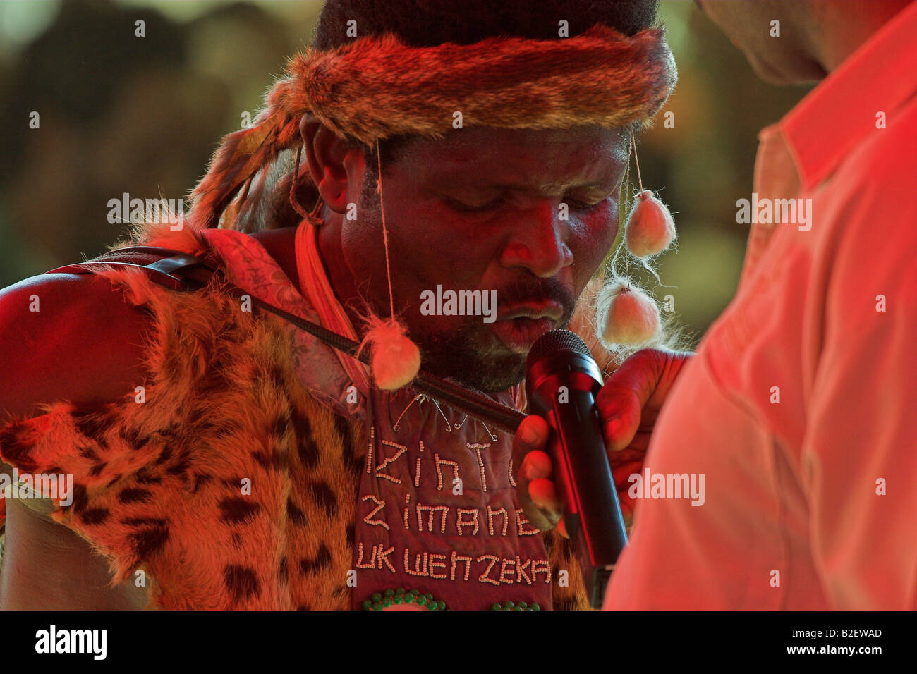 Tonga man in traditional dress singing into a microphone Stock Photo ...