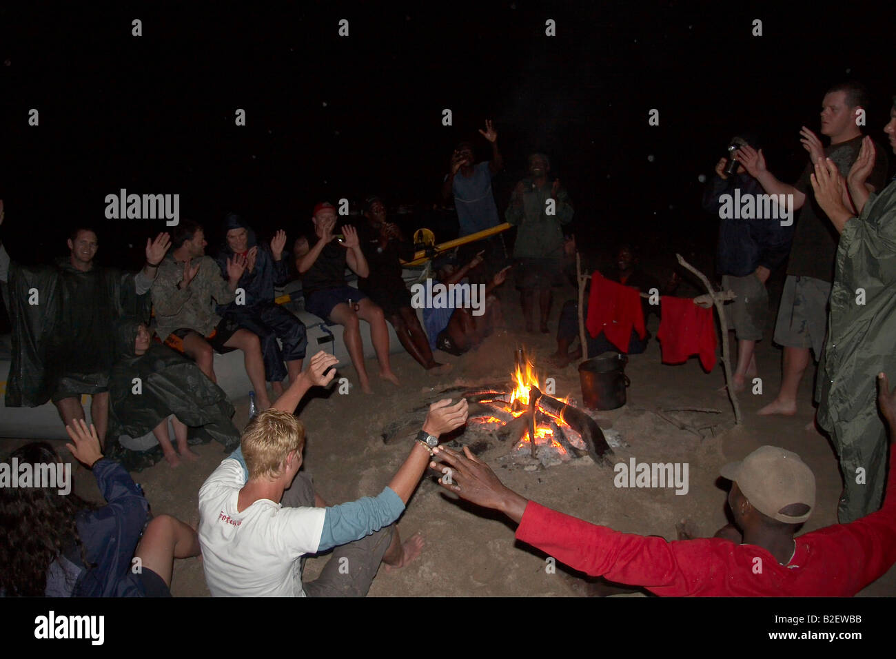 Seated around fire hi-res stock photography and images - Alamy