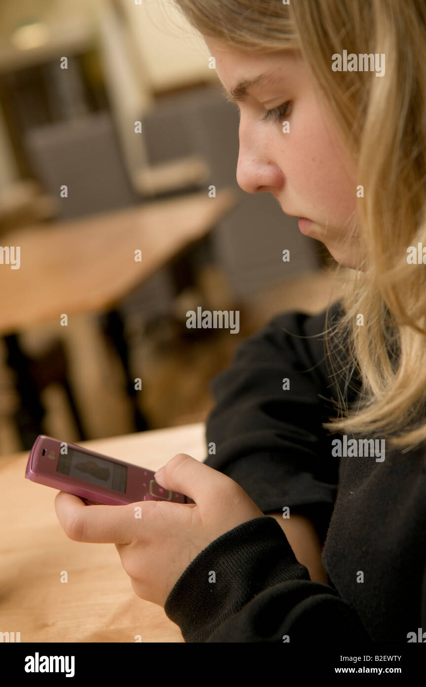 13 year old teenage girl sending picture text message from her mobile ...