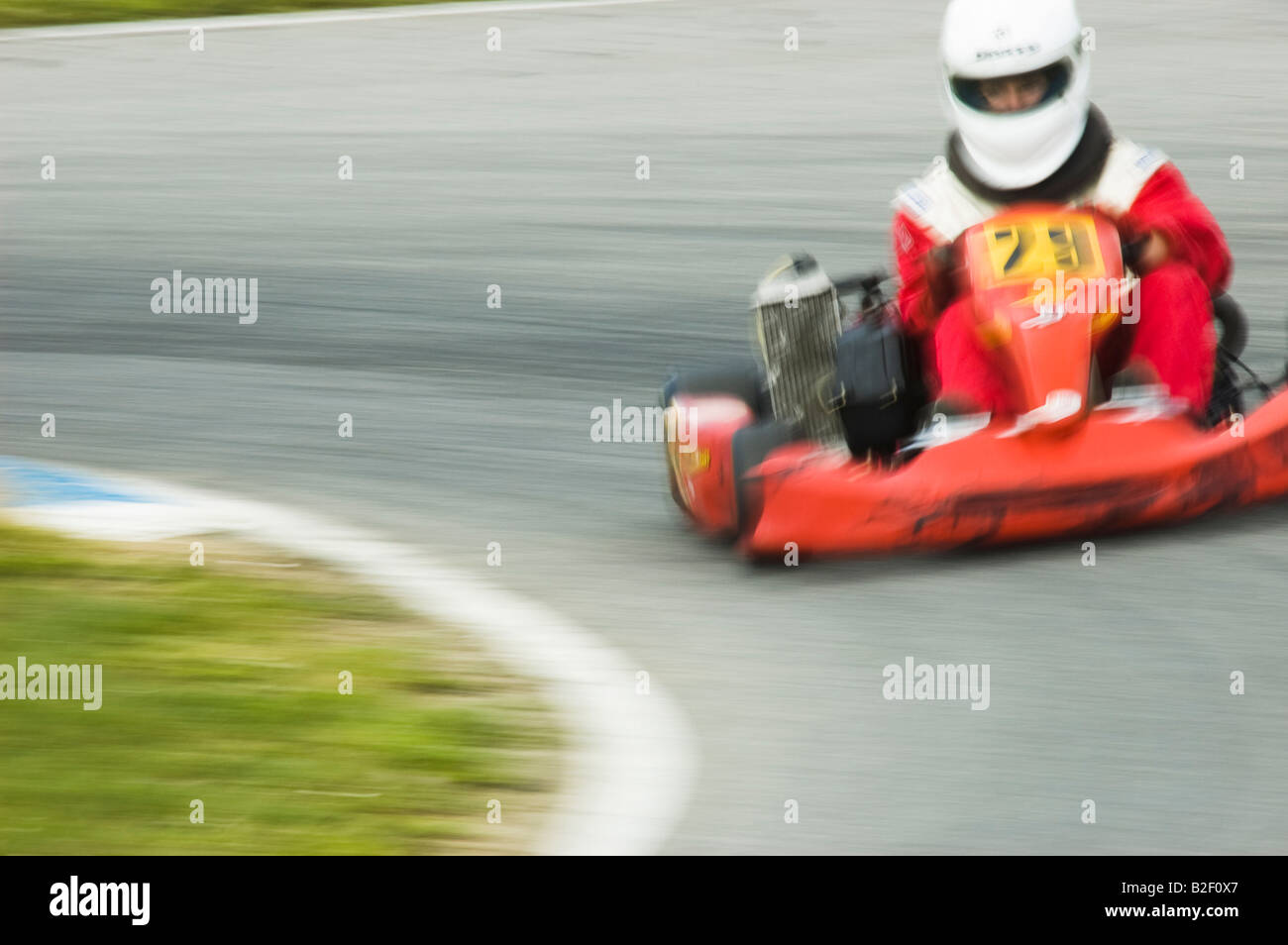 Kart racing driver passing in high speed Stock Photo - Alamy