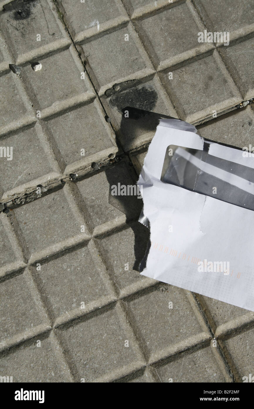 opened letter on envelope on ground in street Stock Photo - Alamy