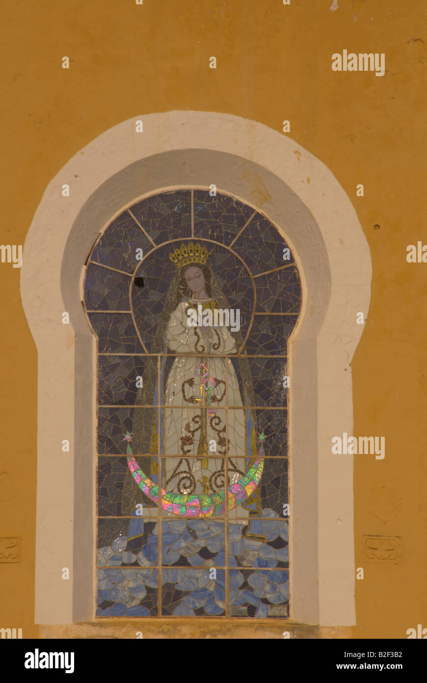 Keyhole shaped stained glass window of the Virgin Mary at Convent of ...