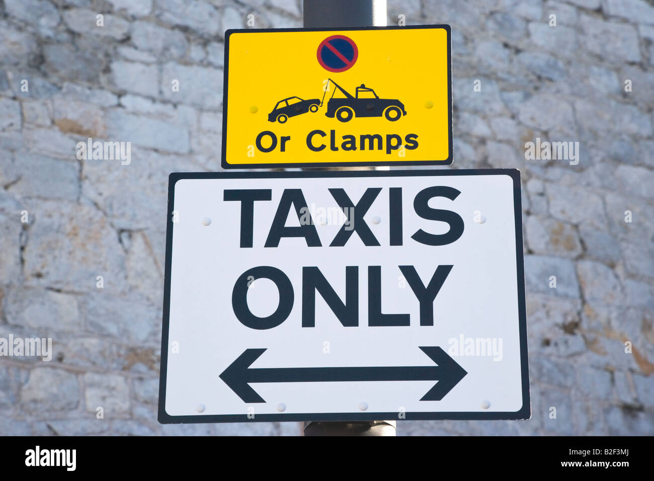 Sign for Taxis Only in both directions and sign announcing illegally ...