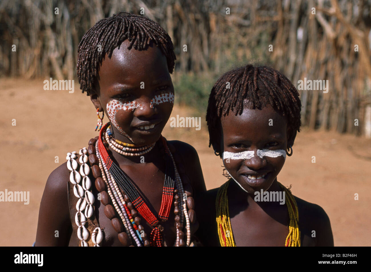 two Hamer girls in cowry shells and beads in the Omo Valley of Ethiopia ...