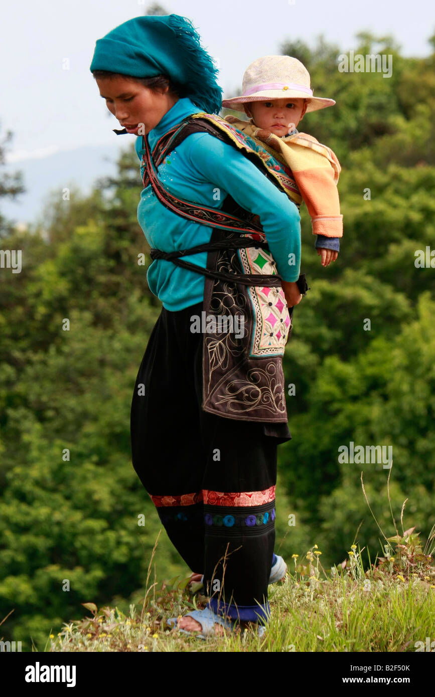 Hani woman and child at the Rice Terraces at Yuanyang, Yunnan, China ...