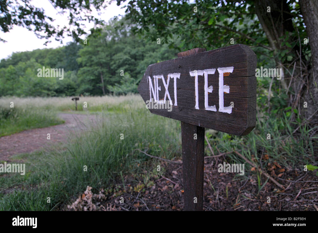Sign reading NEXT TEE, golf course Stock Photo - Alamy