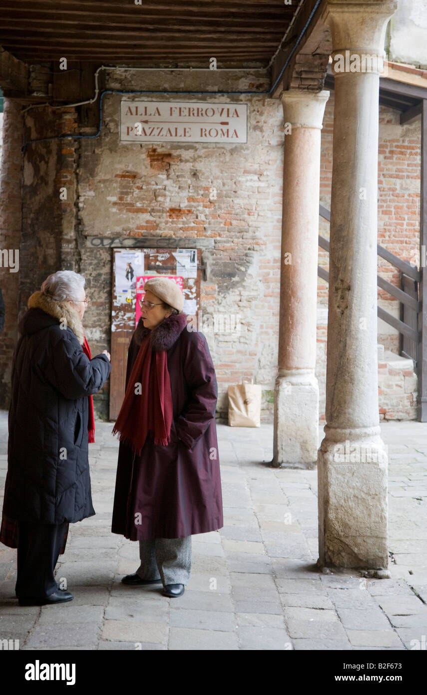 Two old women talking Venice Italy Stock Photo - Alamy