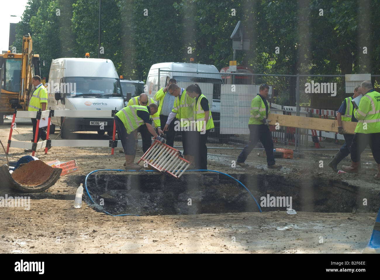 Water company staff preparing to repair a burst water main Stock Photo ...