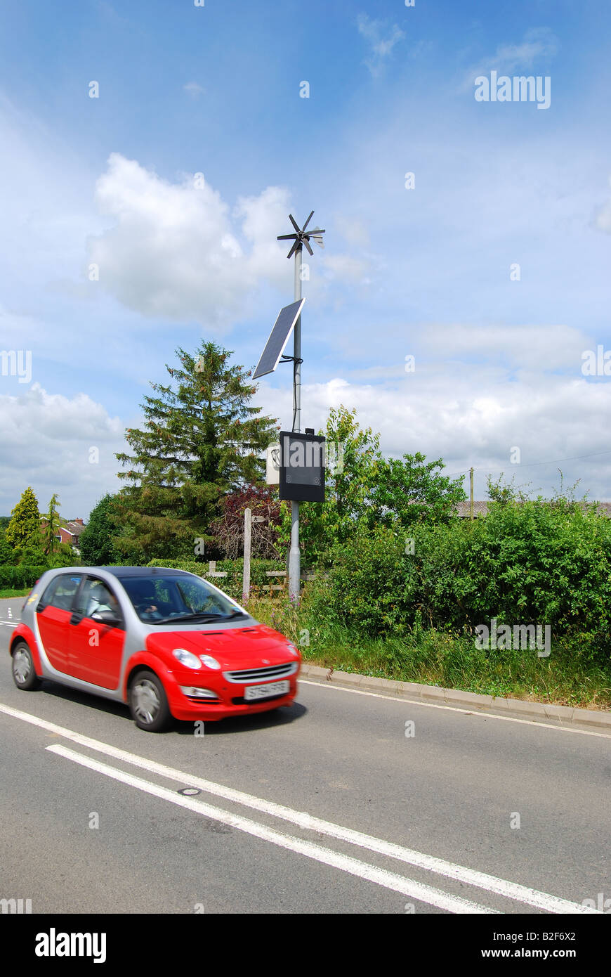 Roadside speed indicator with wind turbine and solar panel, A46 road ...