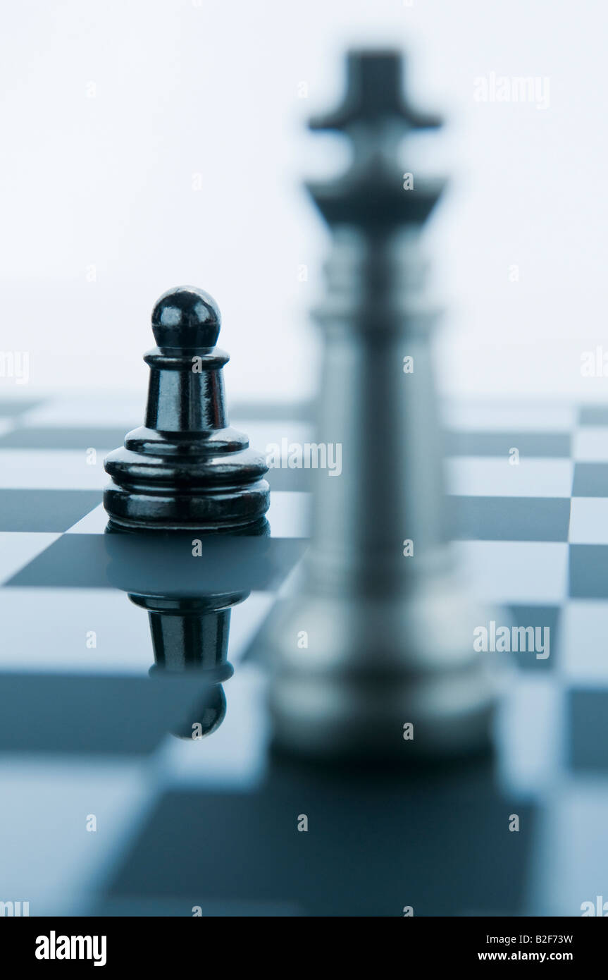 Pawn Facing King Chess Piece Stock Photo - Alamy