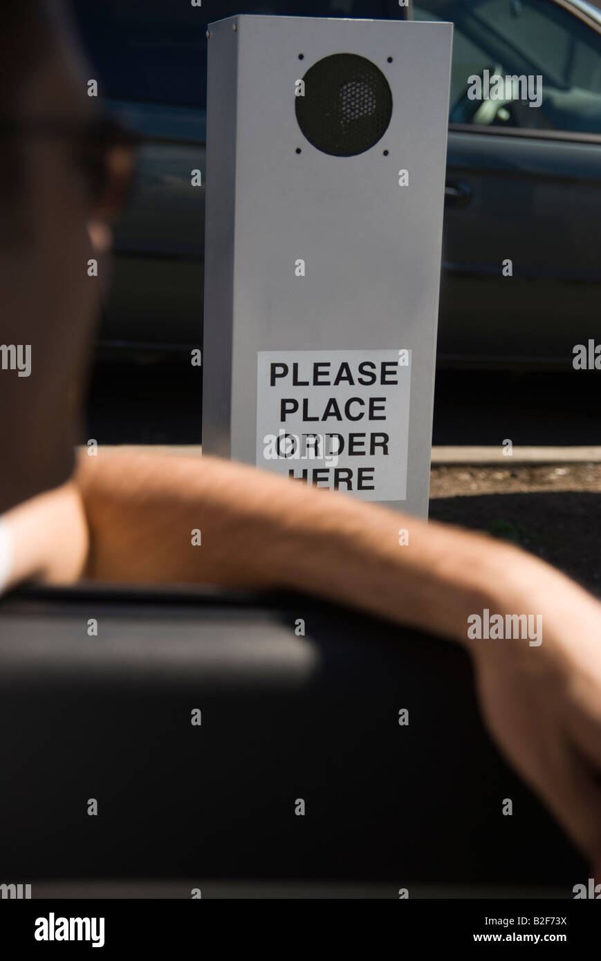 Ordering take out at a drive thru Stock Photo - Alamy