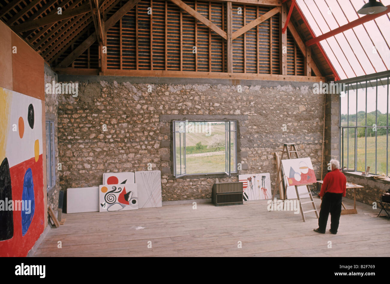 American sculptor and artist Alexander Calder (1898-1976) in his studio ...