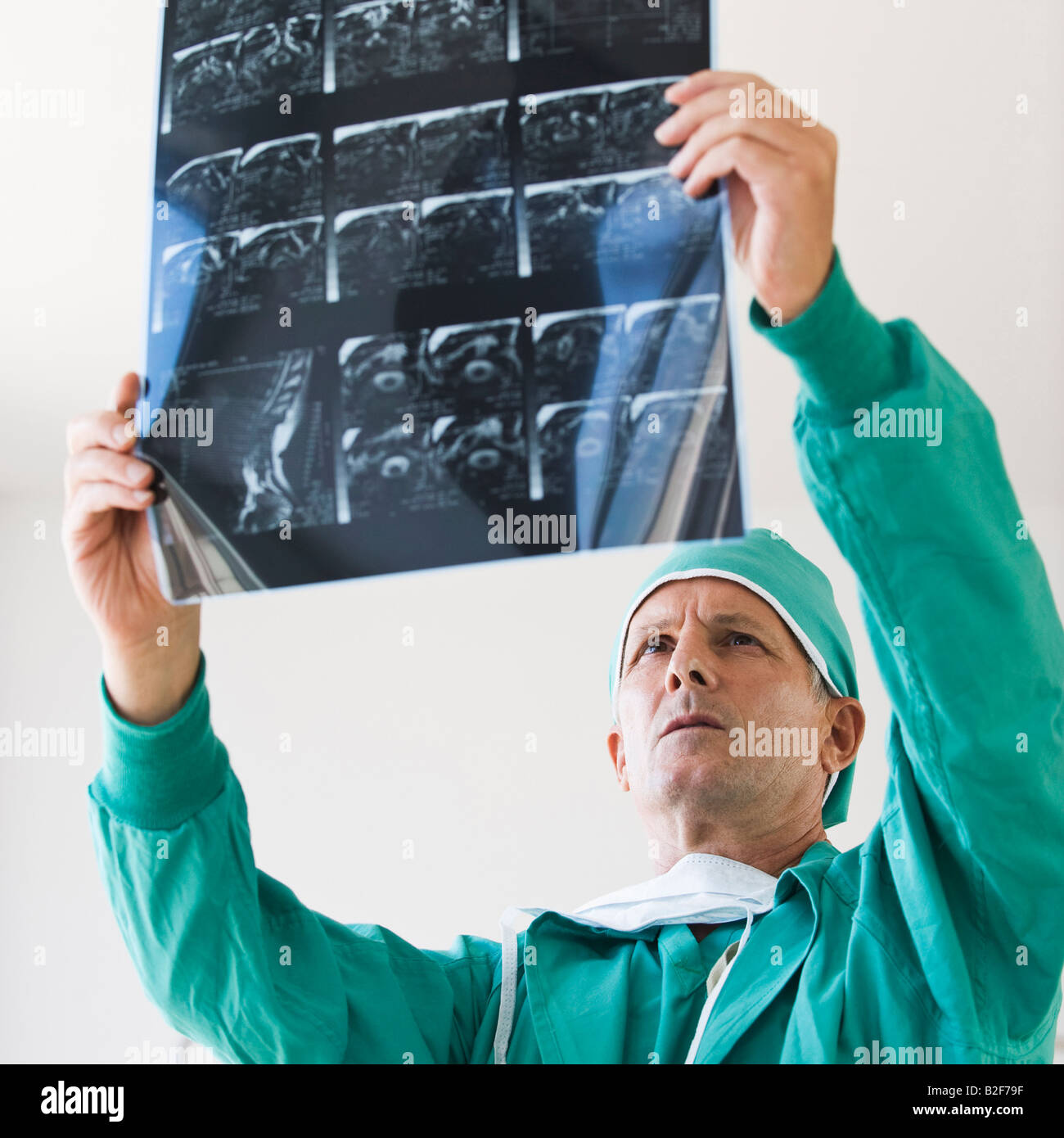 Doctor Looking at X rays Stock Photo - Alamy