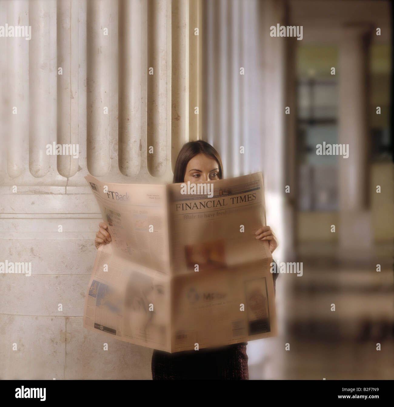 Girl reading Financial Times Stock Photo - Alamy