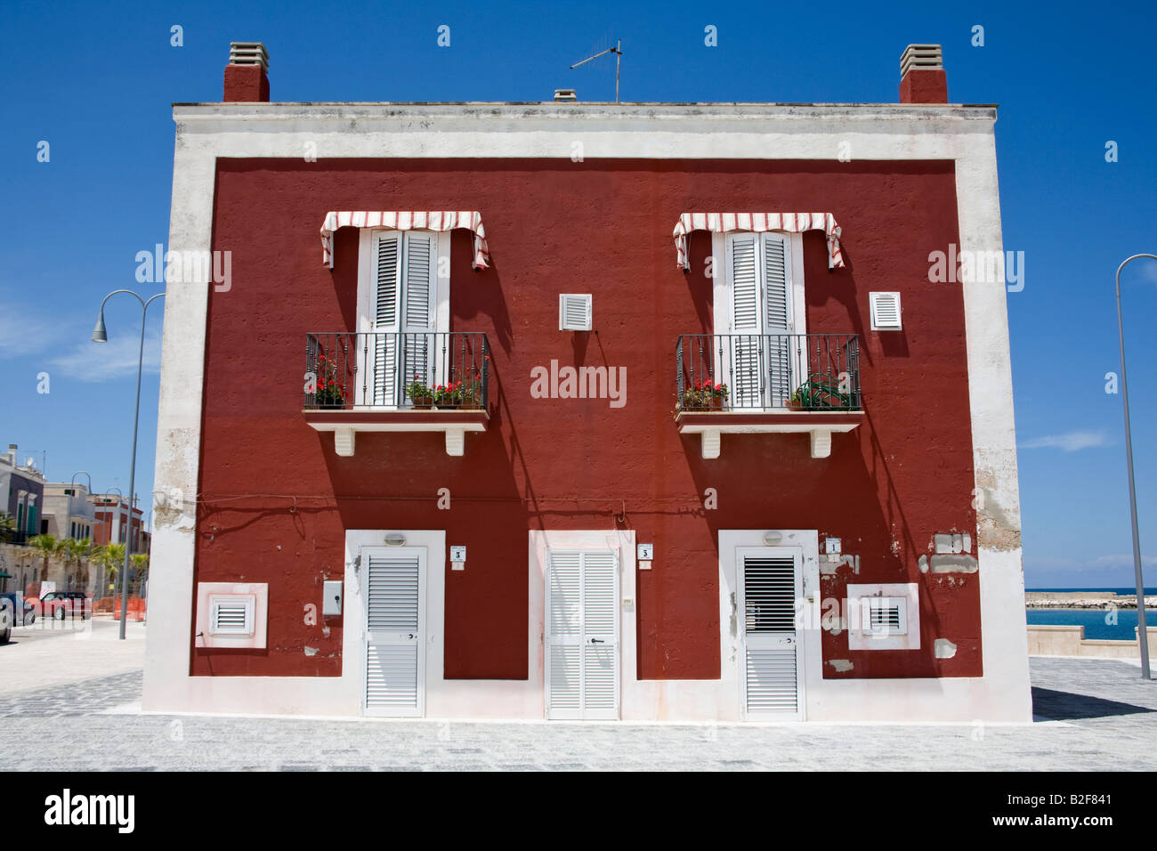 Red house on harbour at Savellitri Puglia Italy June 2008 Stock Photo ...