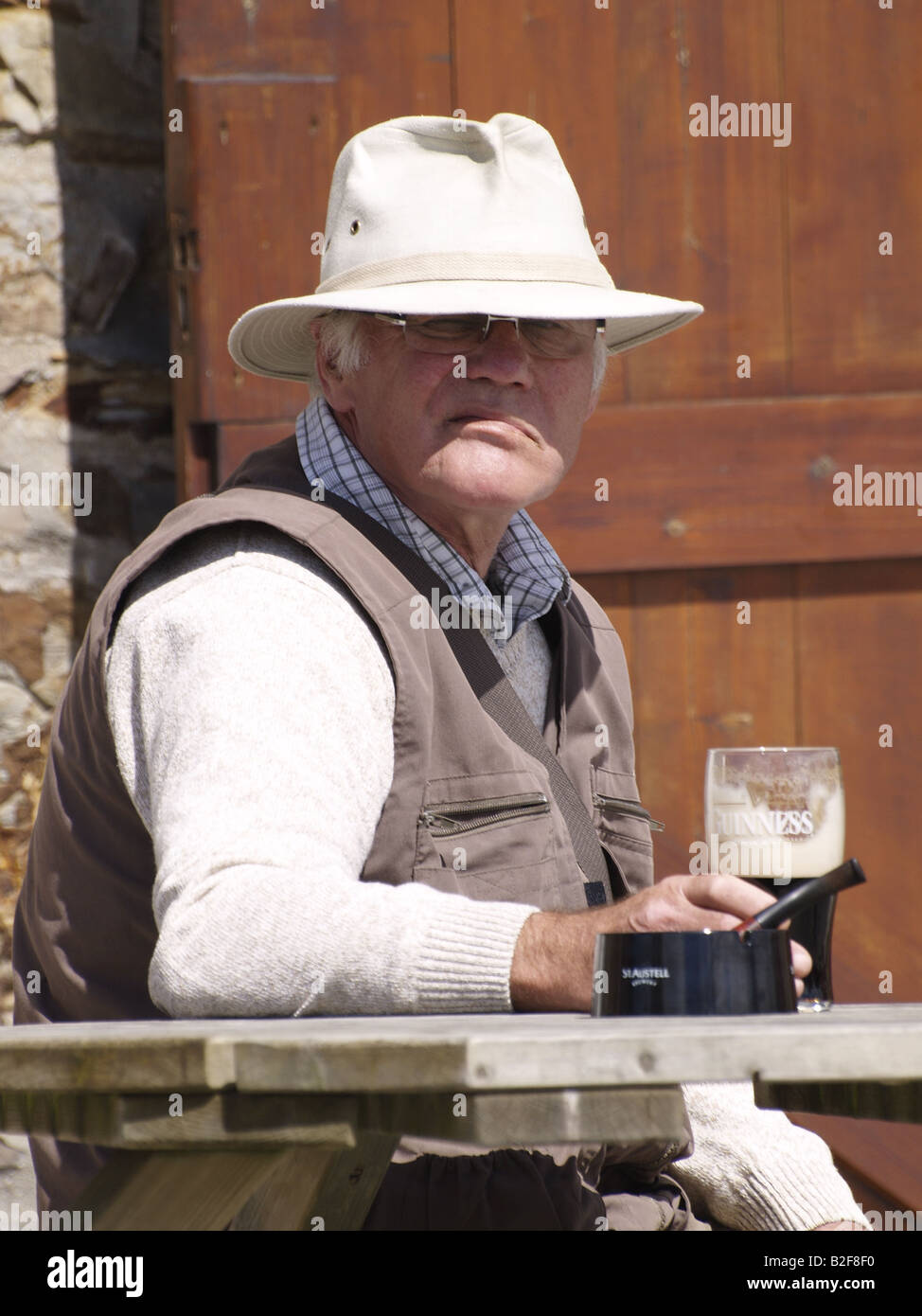 Grumpy old man sitting in hi-res stock photography and images - Alamy