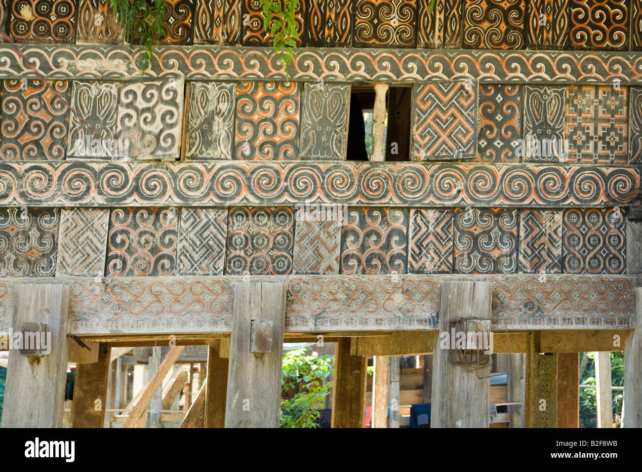 The carved and painted wall detail of an old Torajan house (Sulawesi ...