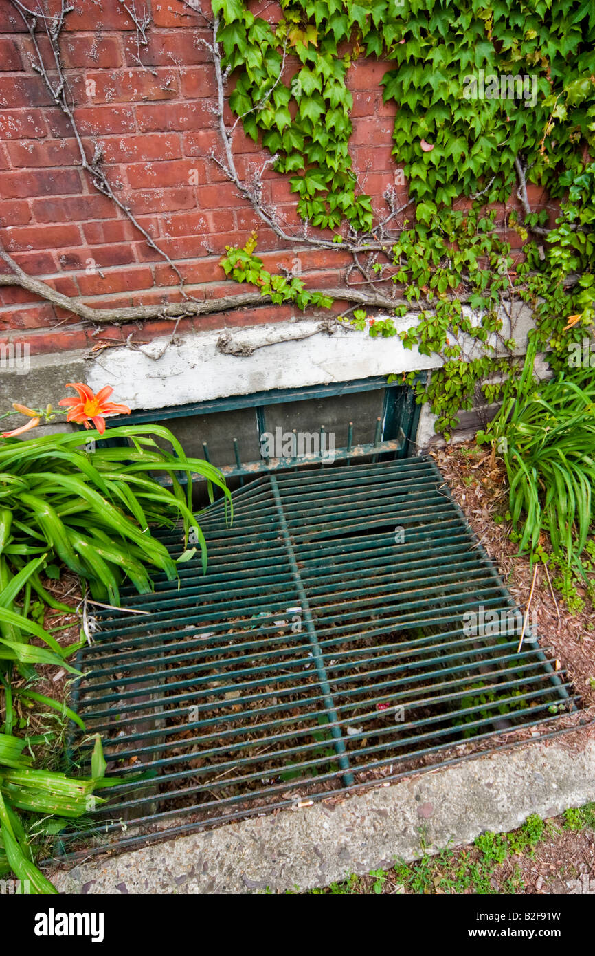 Metal grate covering an open area of a building Stock Photo - Alamy