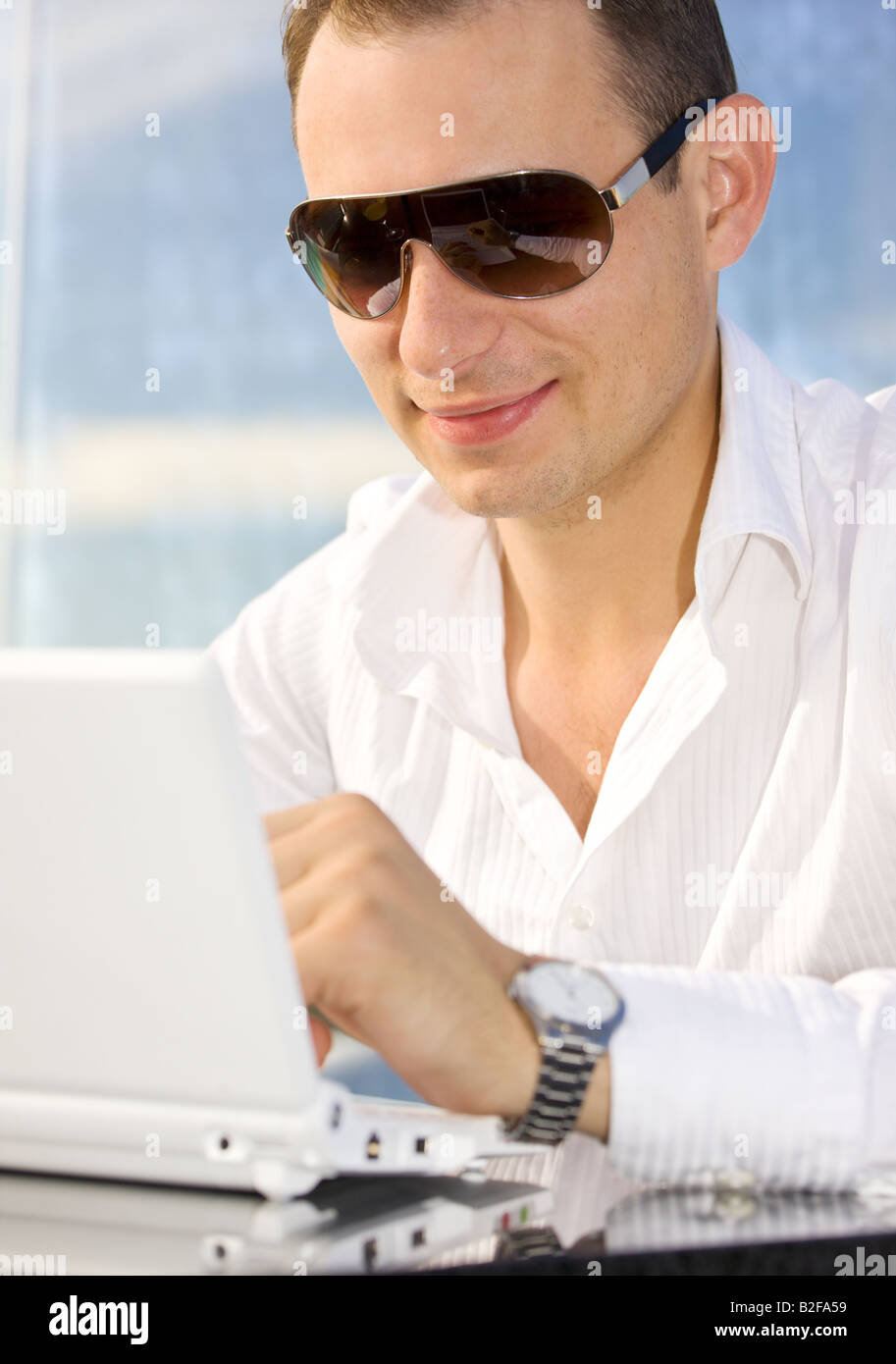 picture of handsome businessman on leisure with laptop Stock Photo - Alamy