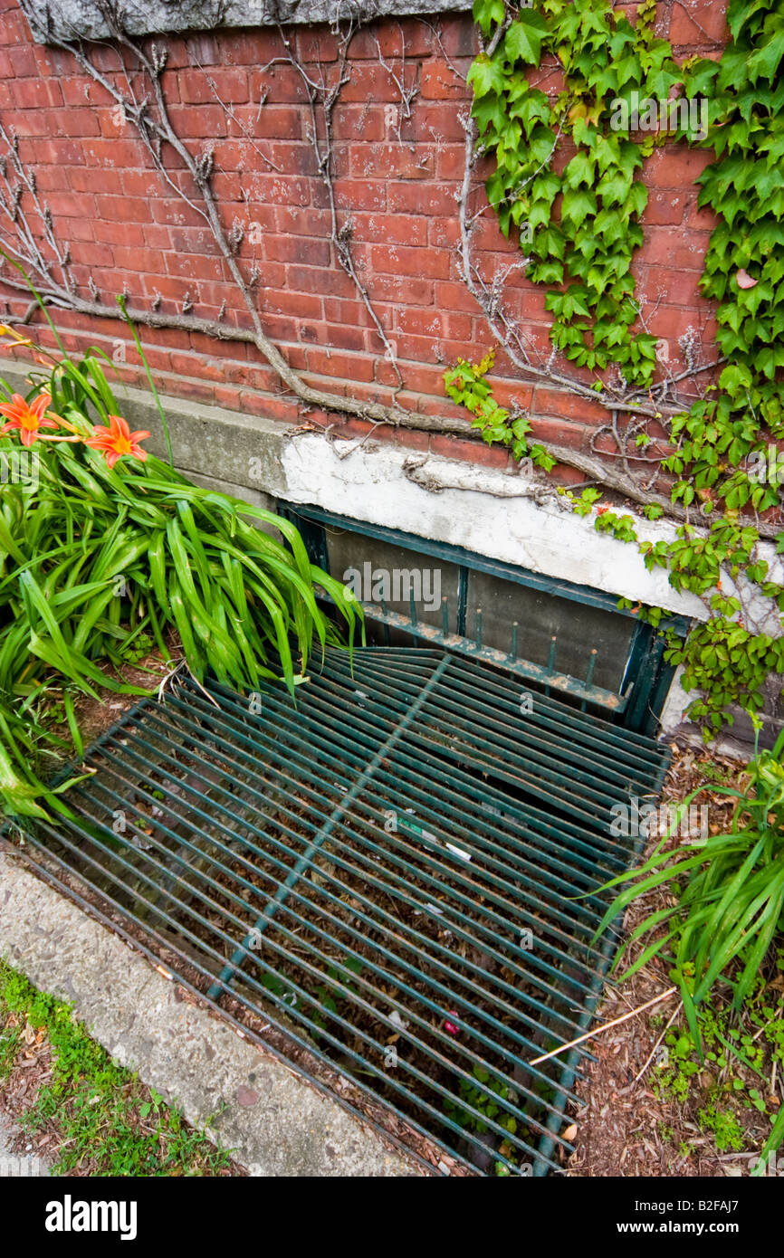 Metal grate covering an open area of a building Stock Photo - Alamy