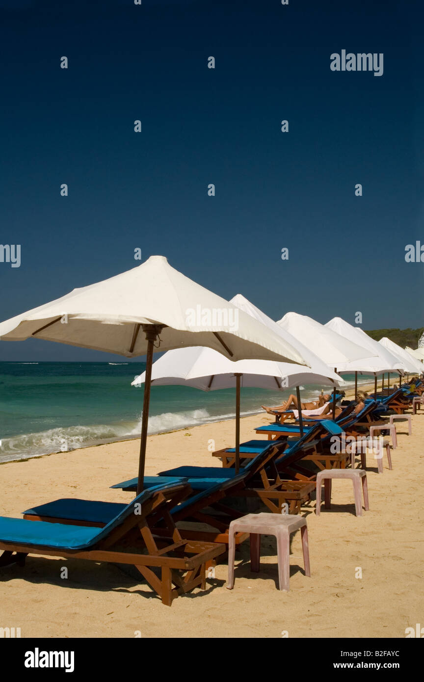tourism sunbathe in the seashore of Geger Beach Stock Photo - Alamy
