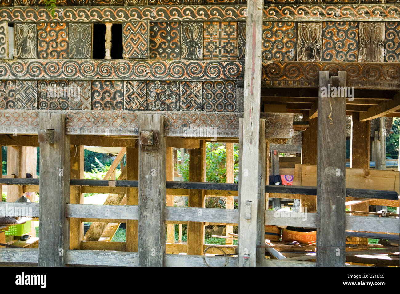 At Lemo, the carved and painted wall detail of an old Torajan house ...