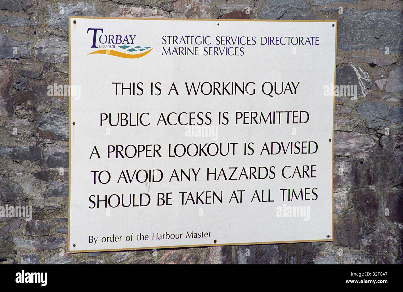 Sign along the harbour side in Brixham Devon England Stock Photo - Alamy