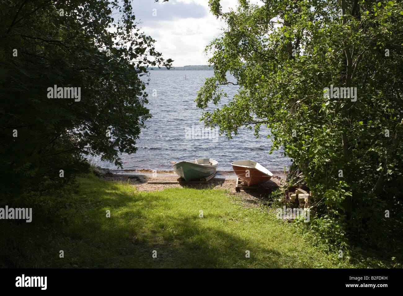 stranded row boats Stock Photo - Alamy