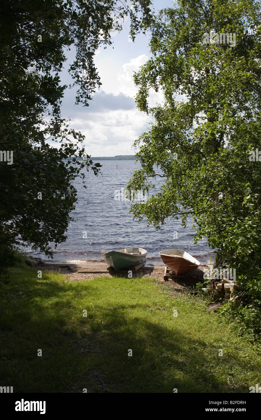 stranded row boats Stock Photo - Alamy
