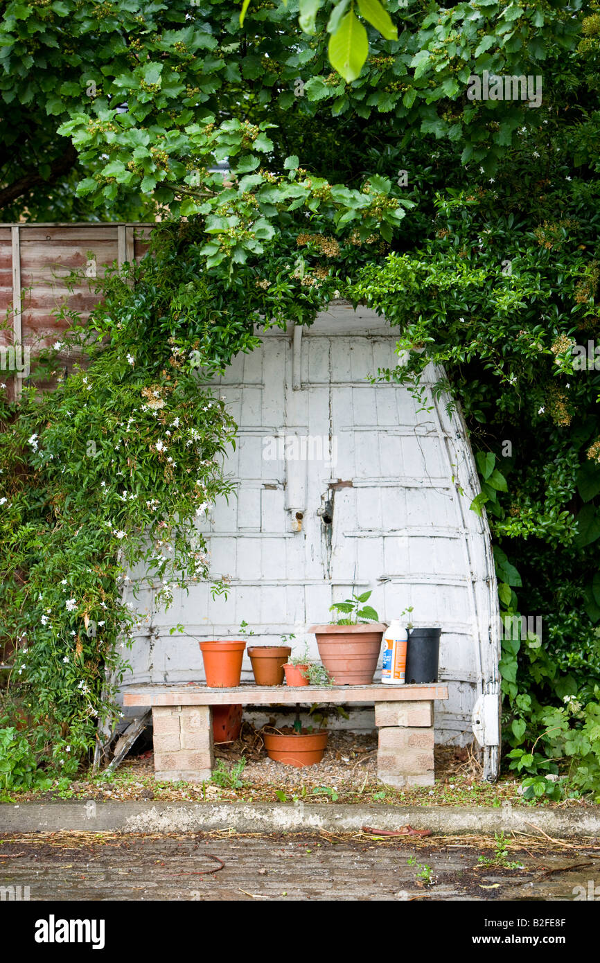 old boat used a garden feature Stock Photo - Alamy